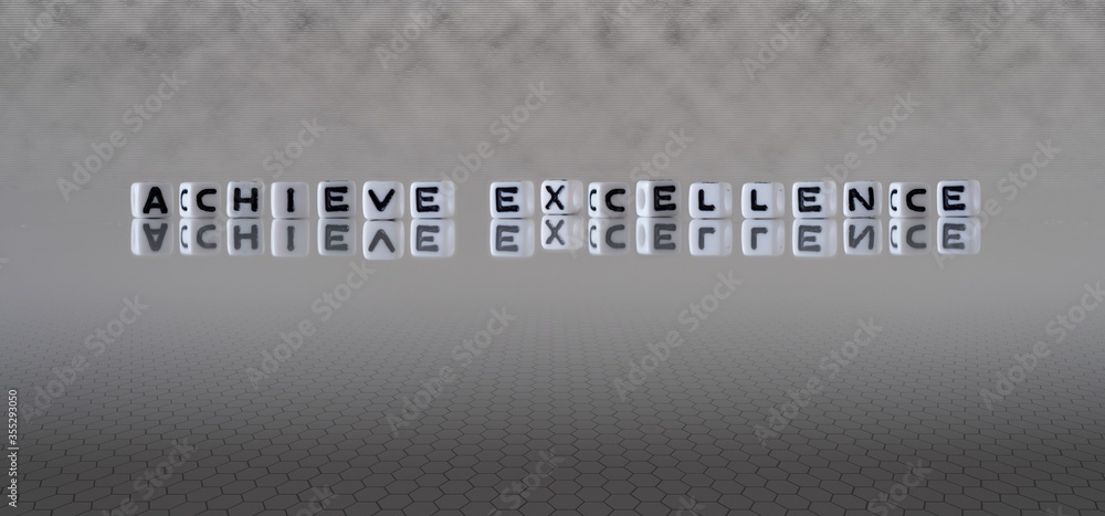 achieve excellence concept represented by black and white letter cubes ...