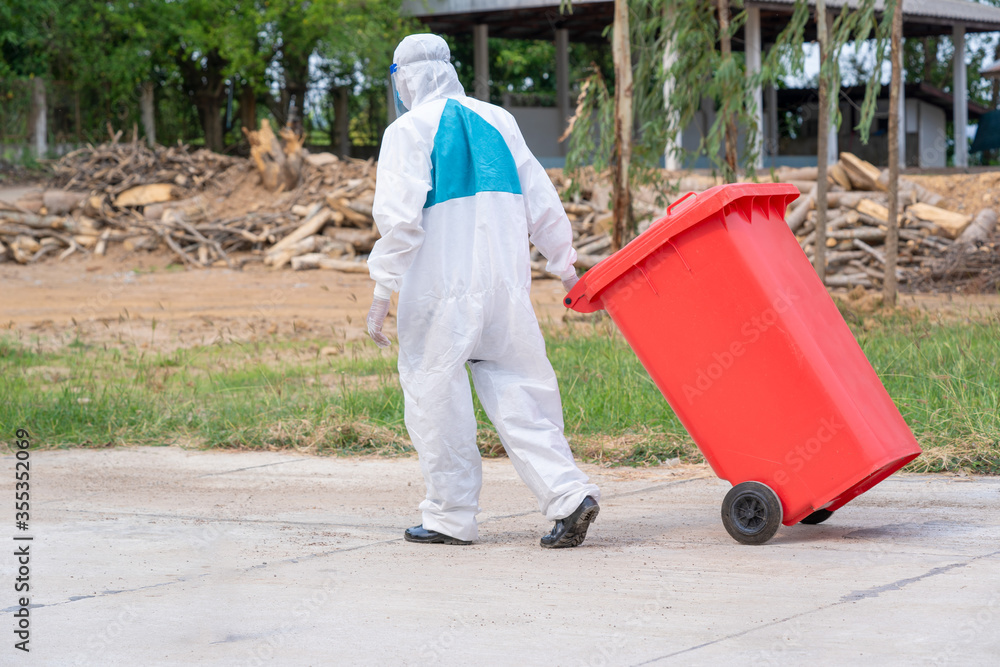 Stop biohazard,Garbage men in coronavirus hazmats working together on ...