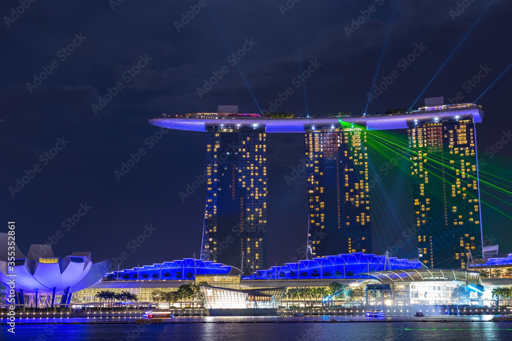 Splendid laser show at Marina Bay Sands in Singapore. Marina Bay Sands is the attraction of ...