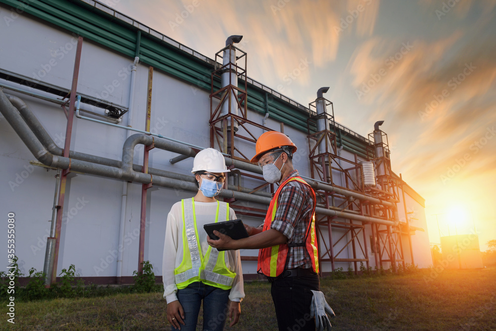engineer discusses technical documentation with his help in the ...