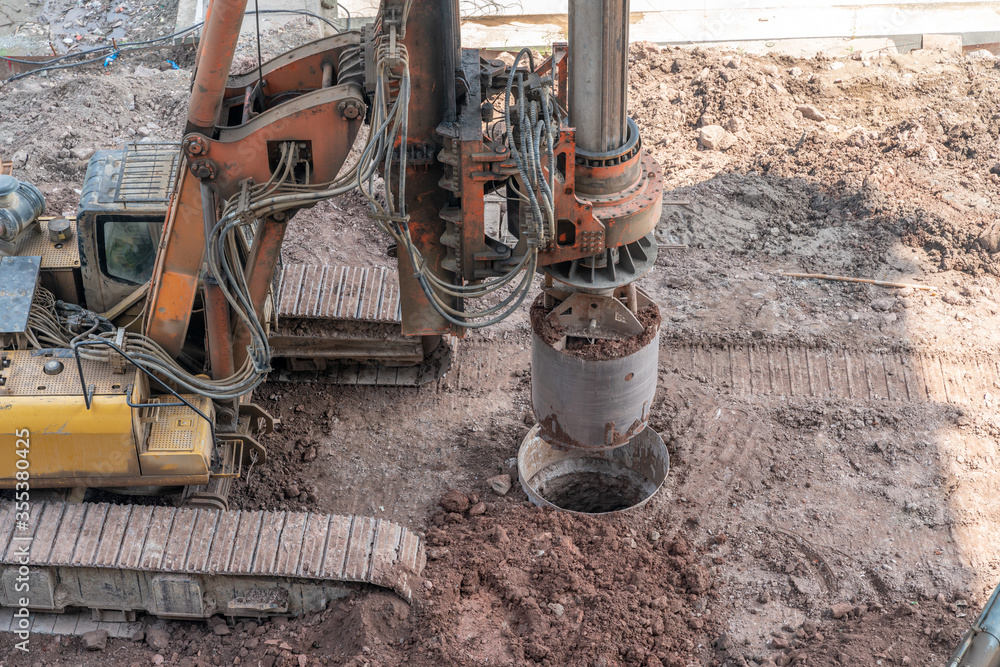 Foto de heavy duty machinery used for drilling holes in the ground on ...