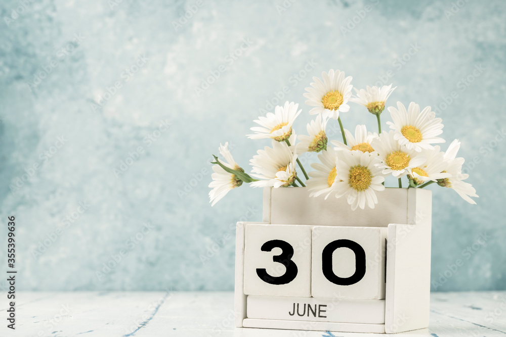 White cube calendar for june decorated with daisy flowers Stock Photo ...
