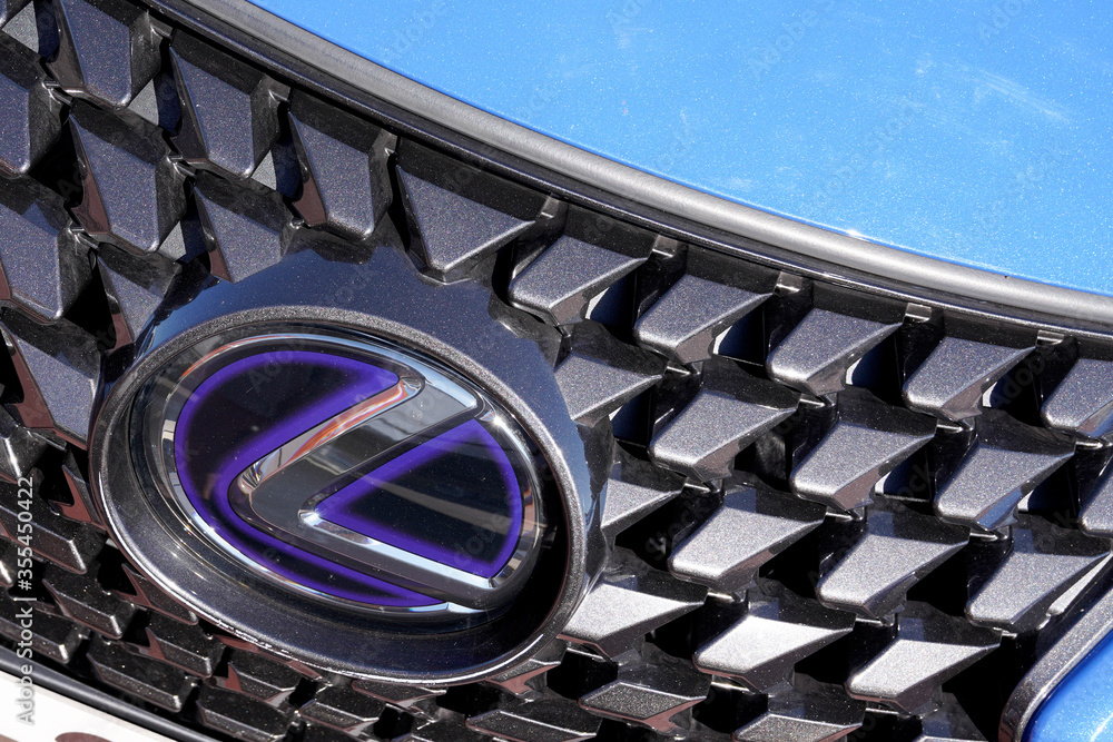 Lexus metal chrome and blue logo sign closeup on hybrid car ...
