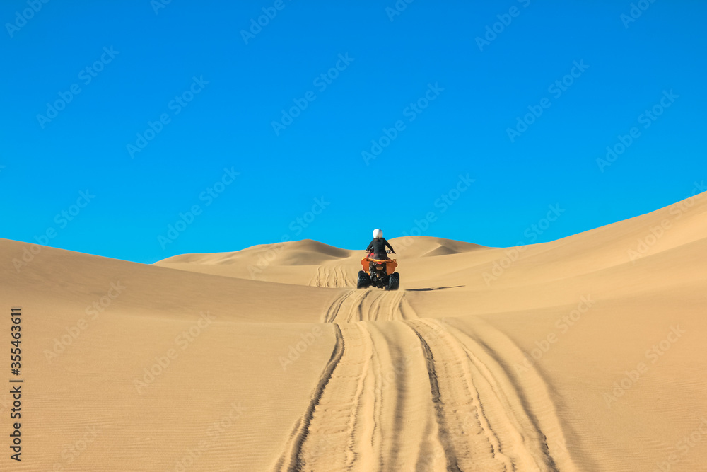 Quad driving people - one happy biker in sand desert dunes, Africa ...