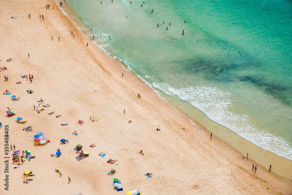 Panoramic view of ocean beach with umbrellas drone view. Beautiful long ...