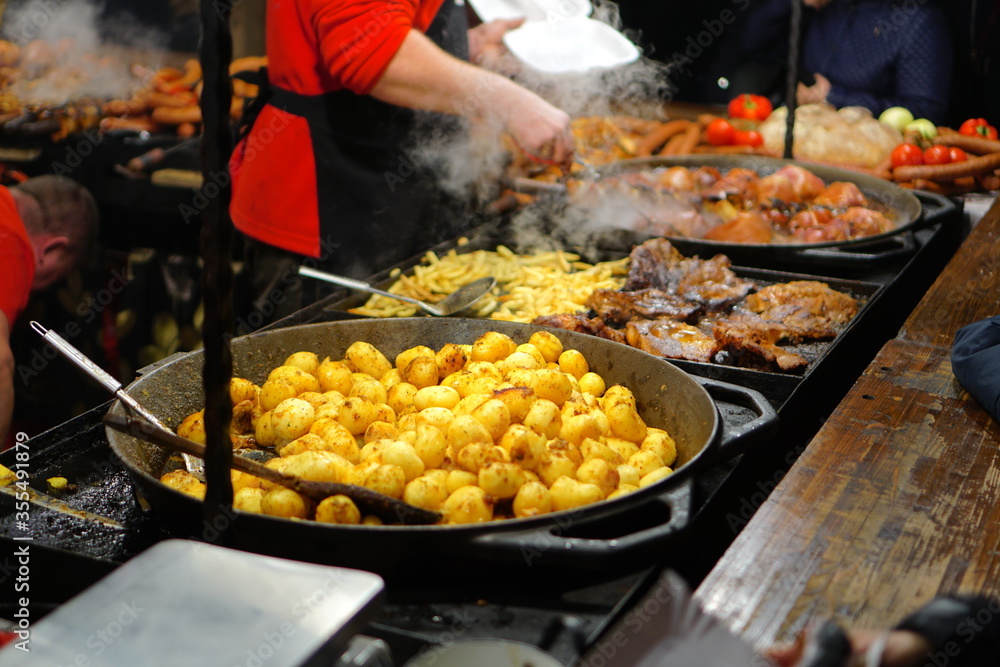 Food booth selling traditional Polish street food at a Christmas Market ...