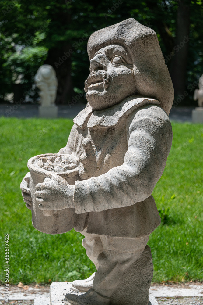 Dwarf statues in Dwarf Garden. Mirabellgarten or Mirabell garden is garden of Mirabell Palace in ...