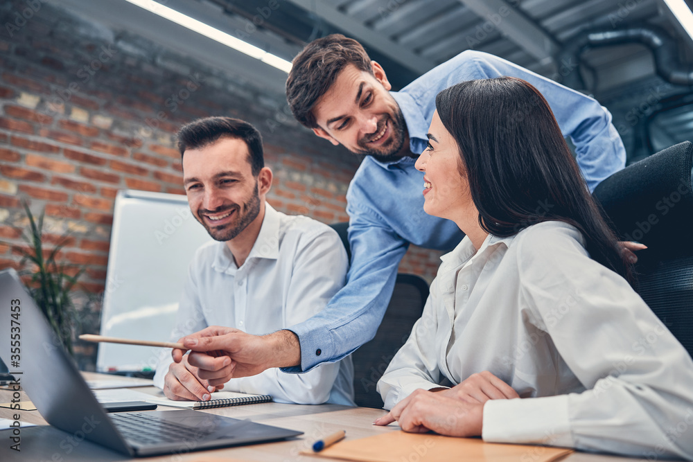 Managers talking about presentation of business project Stock Photo ...