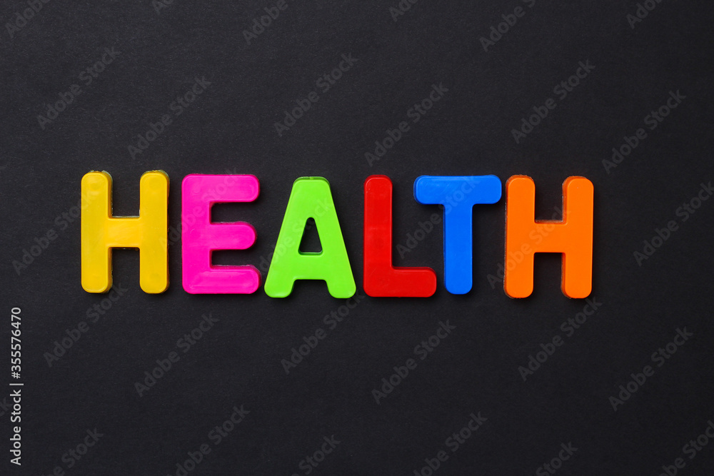 The word HEALTH written in letters of the children's magnetic alphabet ...