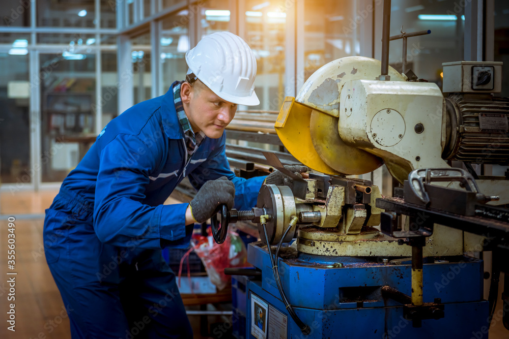 The Industry engineering wearing safety uniform control operating lathe ...