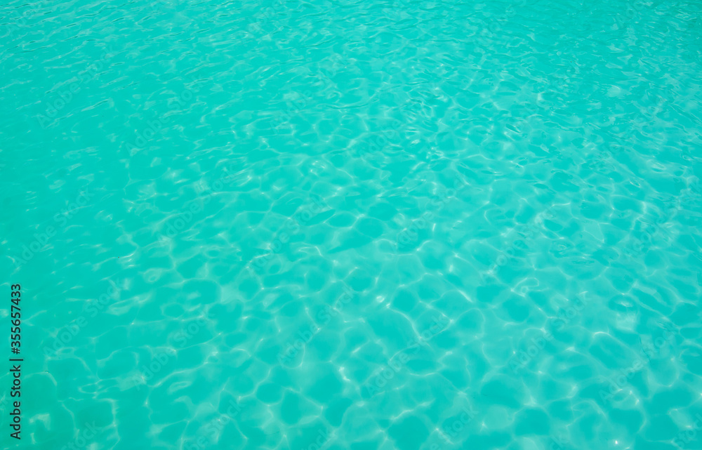 Surface of water swimming pool in swimming pool with sun reflection ...