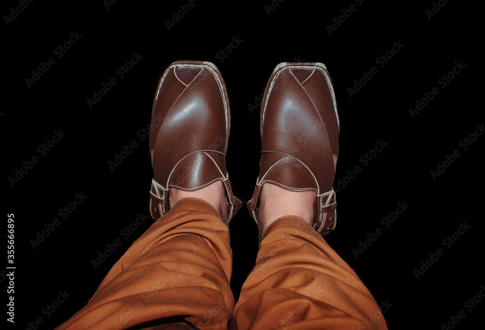 legs with "shalwar"(Pakistani pent) and "Peshawari Chappal" (Pakistani ...