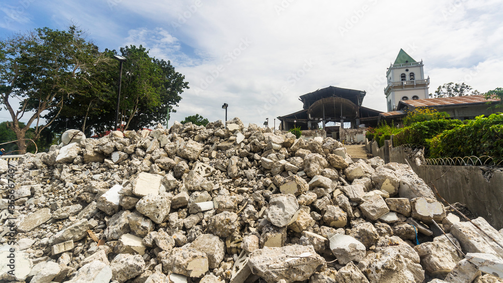 Rubble from a partially destroyed church. Facade of building completely ...