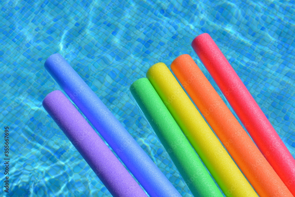 Pool noodles on swimming pool Stock Photo | Adobe Stock