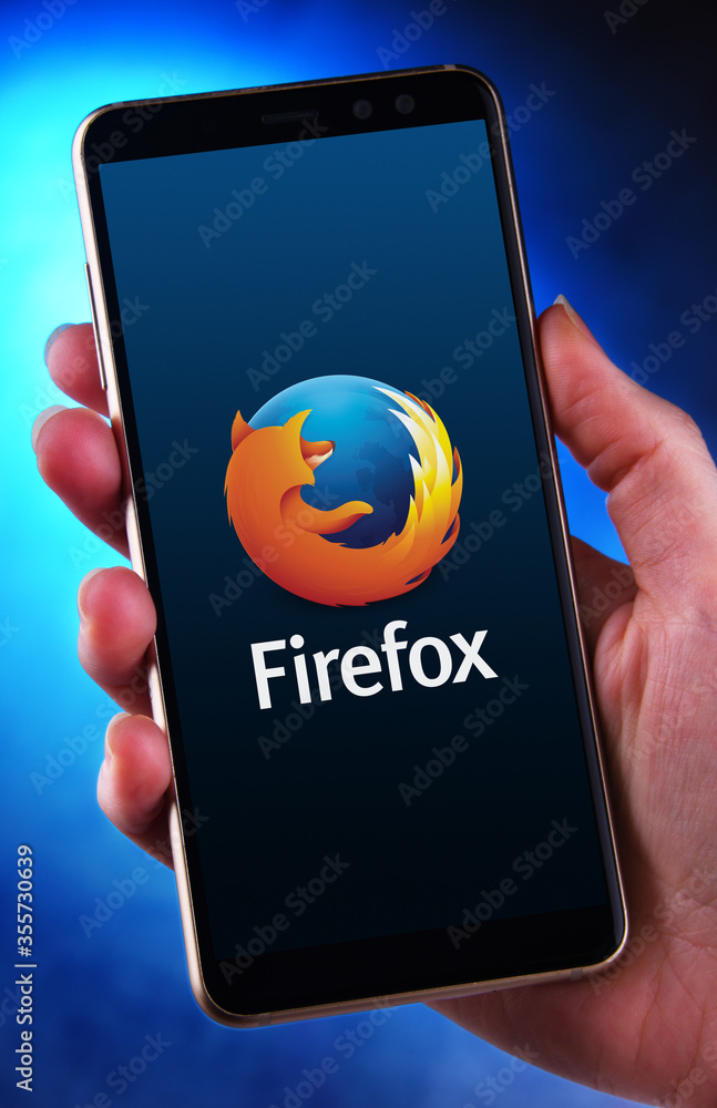 Hand holding smartphone displaying logo of Firefox Stock Photo | Adobe ...