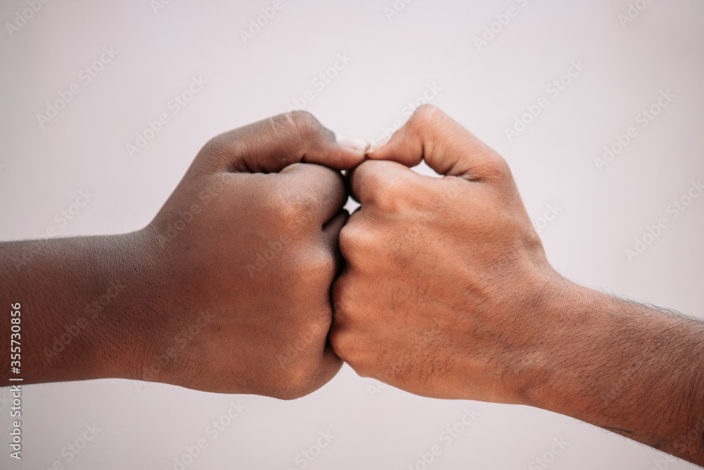 Black African American race male and white Caucasian woman hands giving ...