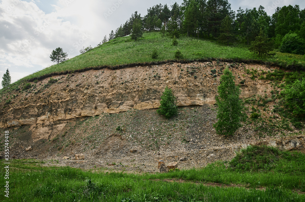 Layers of soil with groundwater. Details of earth layers in a clay pit ...