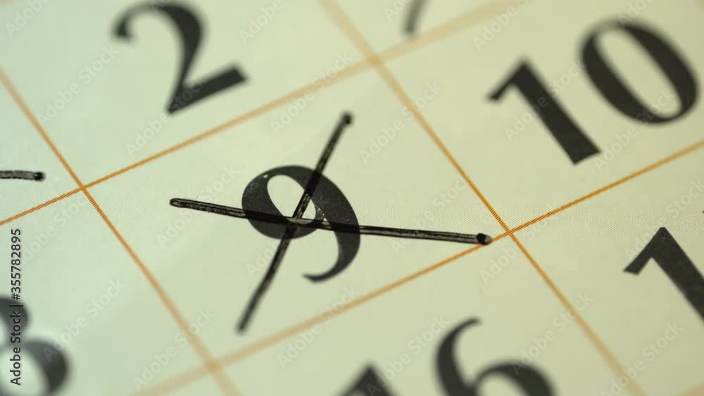 9th – ninth day of the month. The woman crossed out the calendar date ...