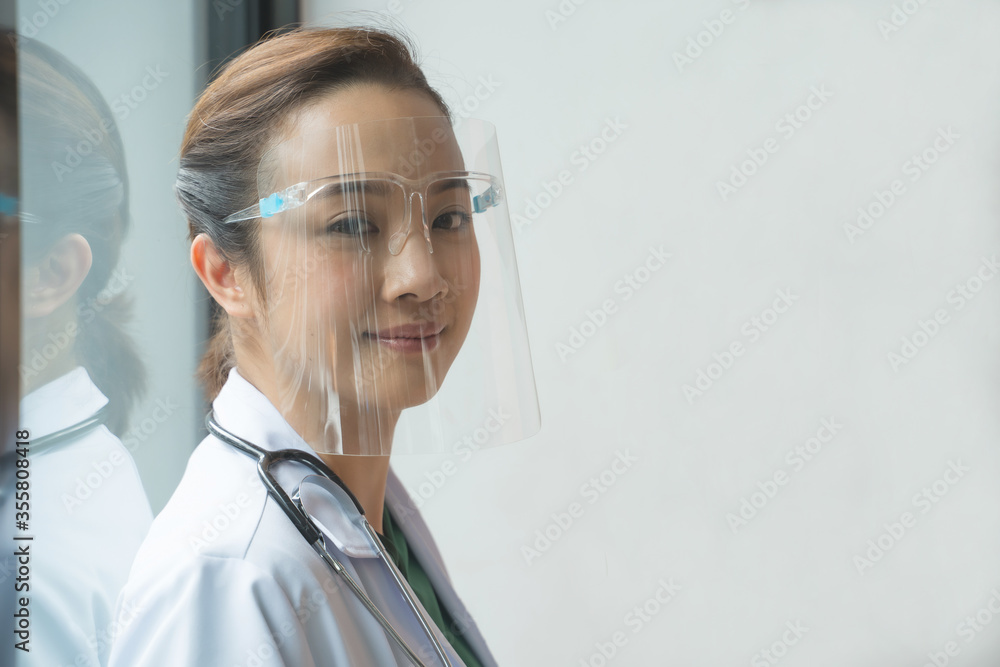 Asian female doctors wear face shields to protect against viruses Gene ...