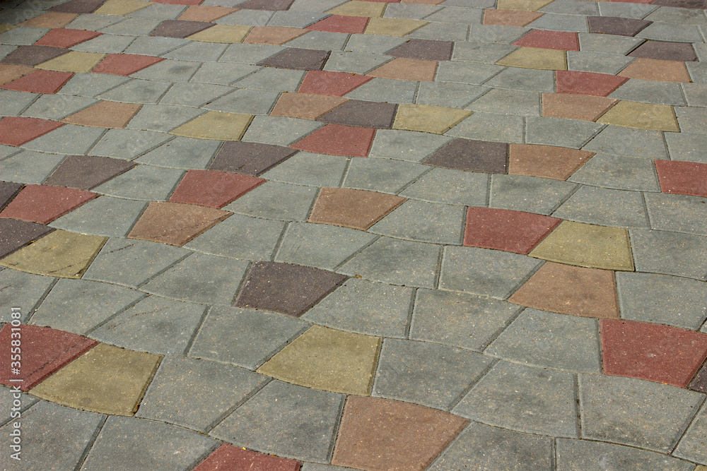 Beautiful bright summer modern multi-colored paving slabs on a ...
