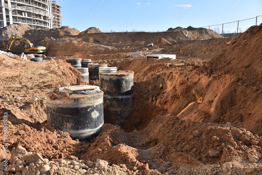 Laying concrete manholes and heating drain pipes and for stormwater ...