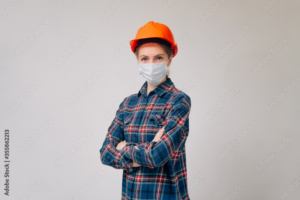 Girl builder during pandemic looks ahead sad, dismissal from work ...