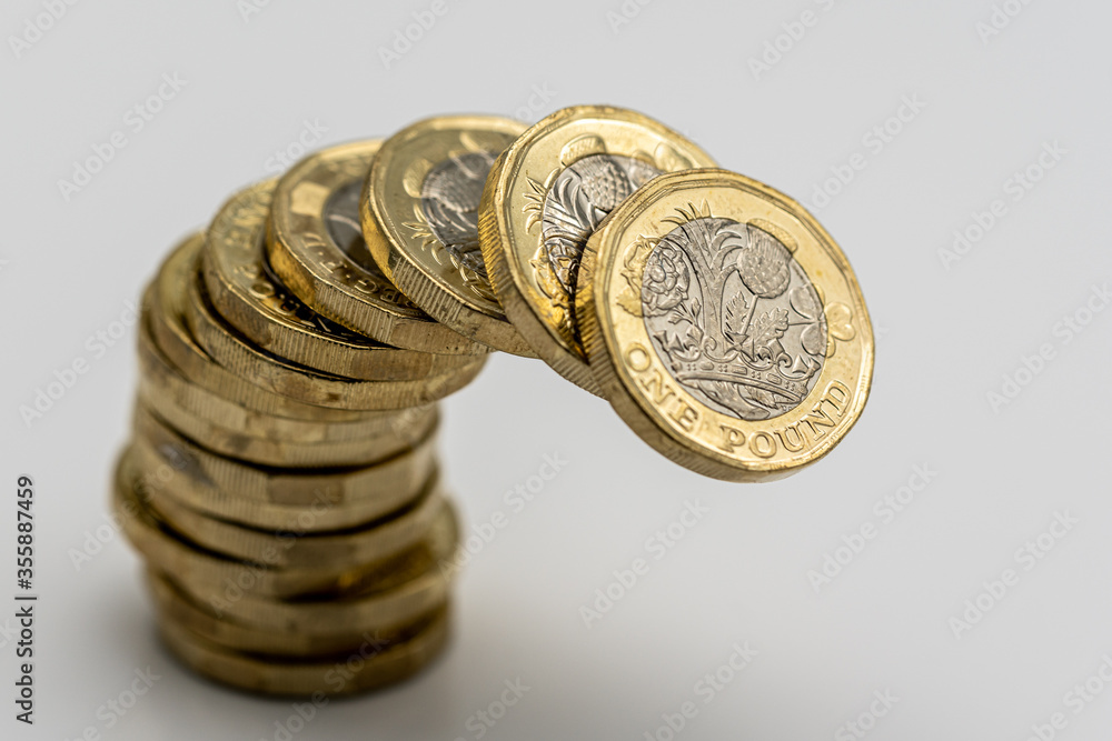 Stack of UStack of UK Sterling pound coins pictured while falling K ...