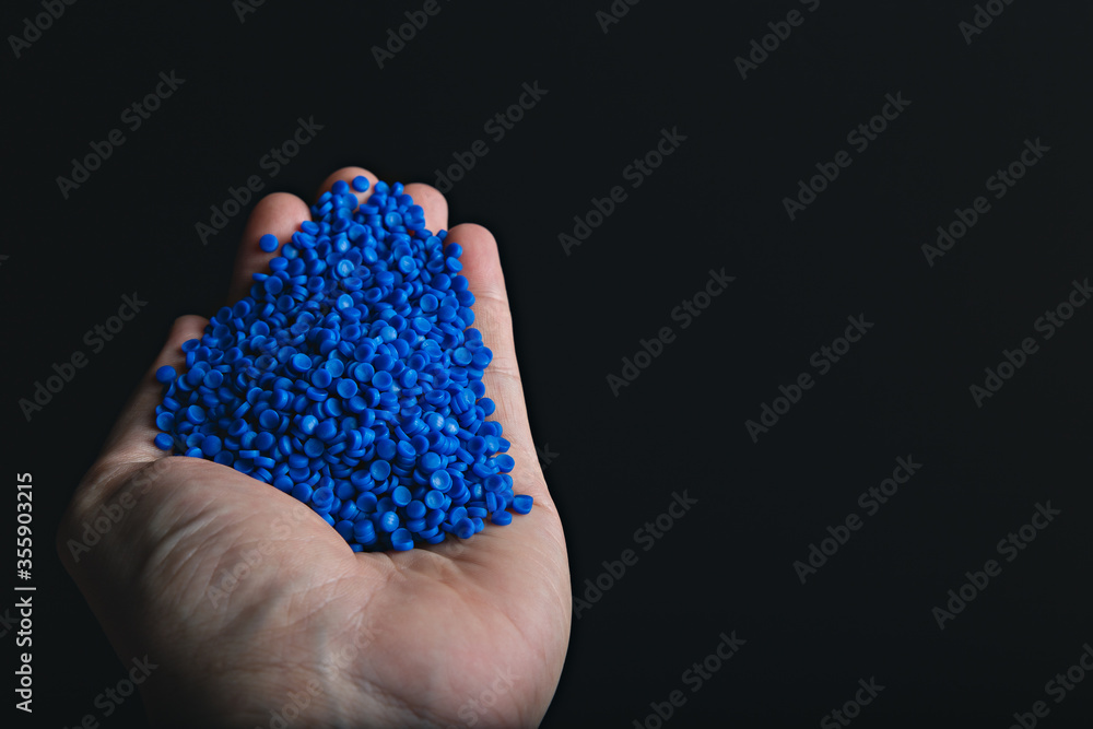 Blue plastic grain, plastic polymer granules,hand hold Polymer pellets ...