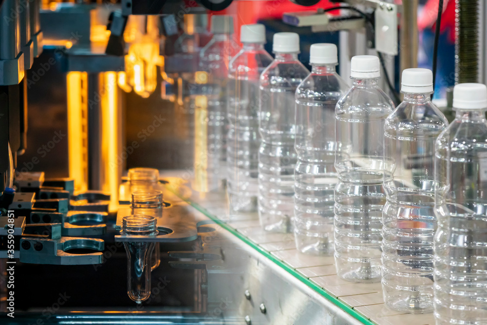 The abstract scene of tube preform shape of bottles preheat process and ...