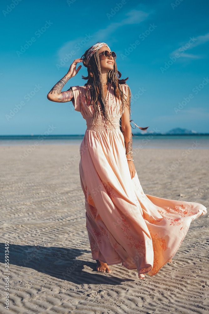 Beautiful young woman posing on the beach swim suit.Happy smiling girl ...