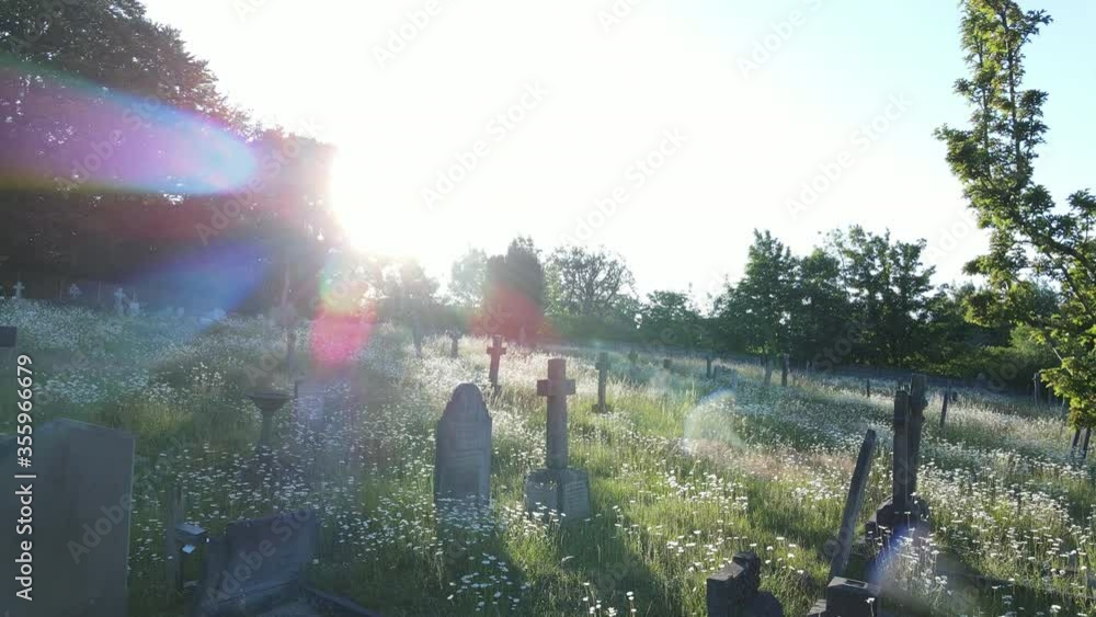 Graveyard drone shots. Tombs in a large cemetery with walkways between ...