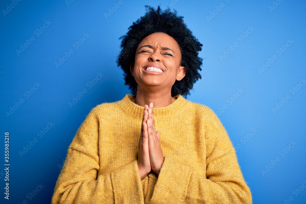 Young beautiful African American afro woman with curly hair wearing ...