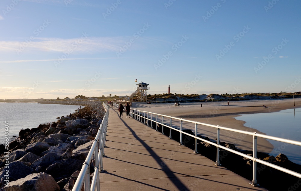 Looking West on the Ponce Inlet Florida jetty the life guard station ...