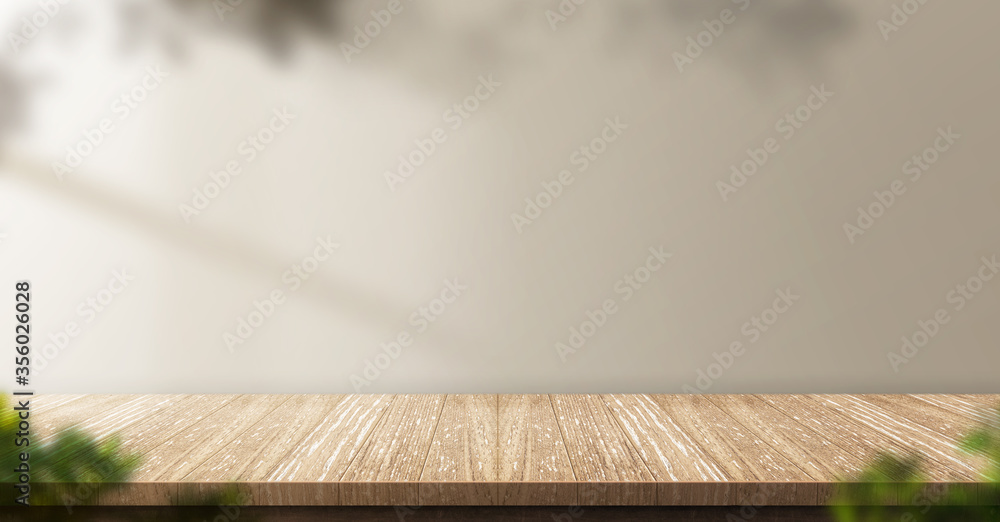 wood table background with sunlight window create leaf shadow on wall ...