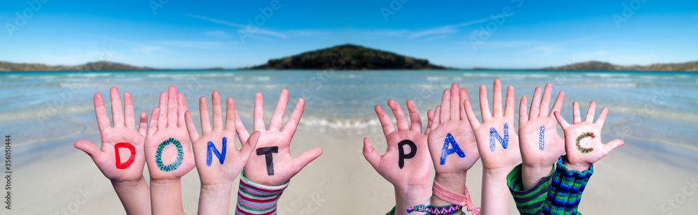Kids Hands Holding Colorful English Word Do Not Panic. Ocean And Beach ...