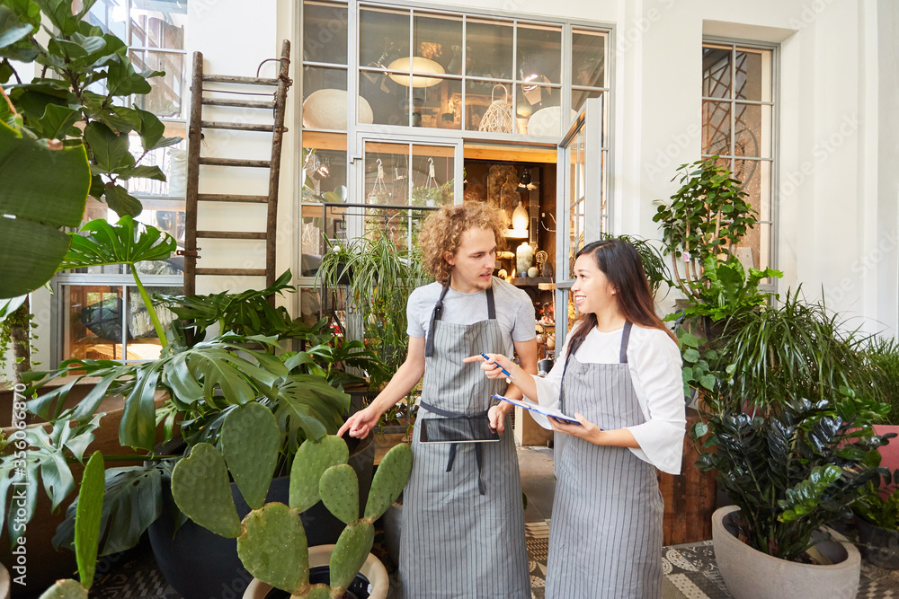 Florist team with tablet computer during inventory Stock Photo | Adobe ...
