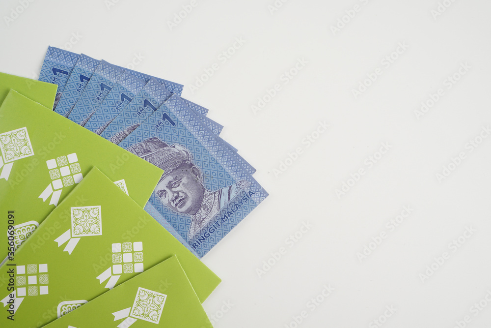 'Duit Raya' is money given from adult to children during Eid al-Fitr ...