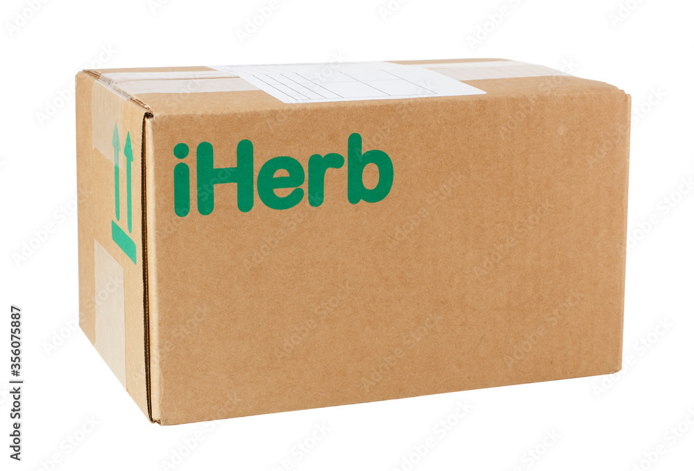 Box with the brand logo iHerb. Closeup isolated on a white background ...