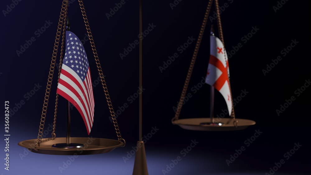 Flags of the USA and Georgia on the bowls of the balance scales on a ...