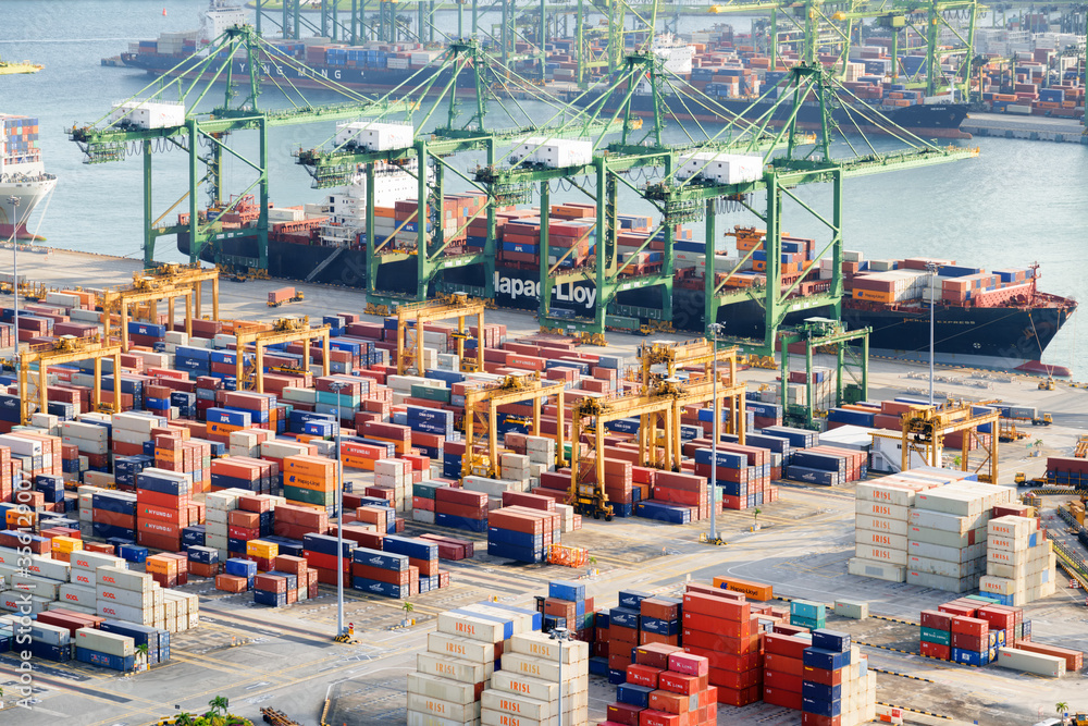 Container terminal at the Port of Singapore. Cargo ship docked Stock ...