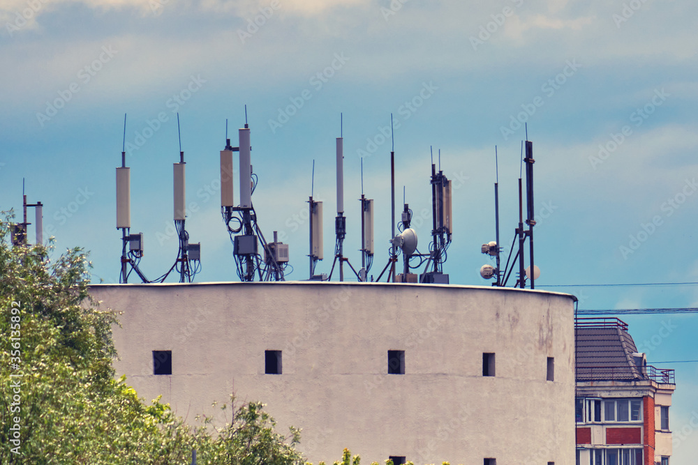 Antennas and 5g cellular base stations on the roof of the building ...