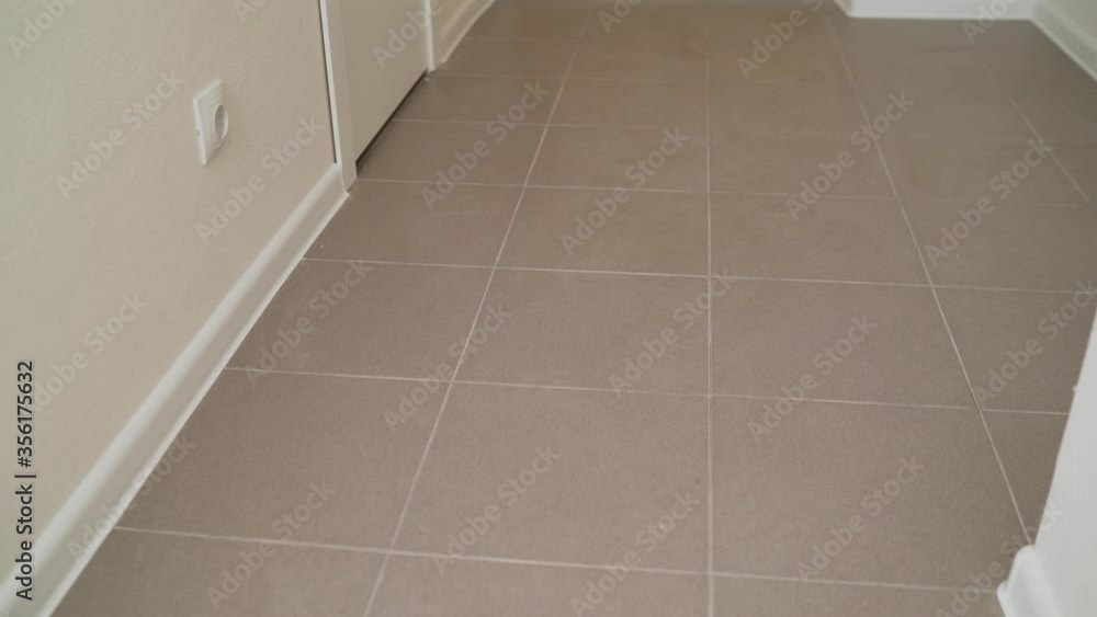 Stockvideo Floor tile. Tile gray and white skirting. The floor tile is ...