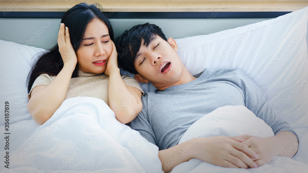 Concept Snore. Apnea can cause death while sleeping. Family Asian couples have sleep problems ...