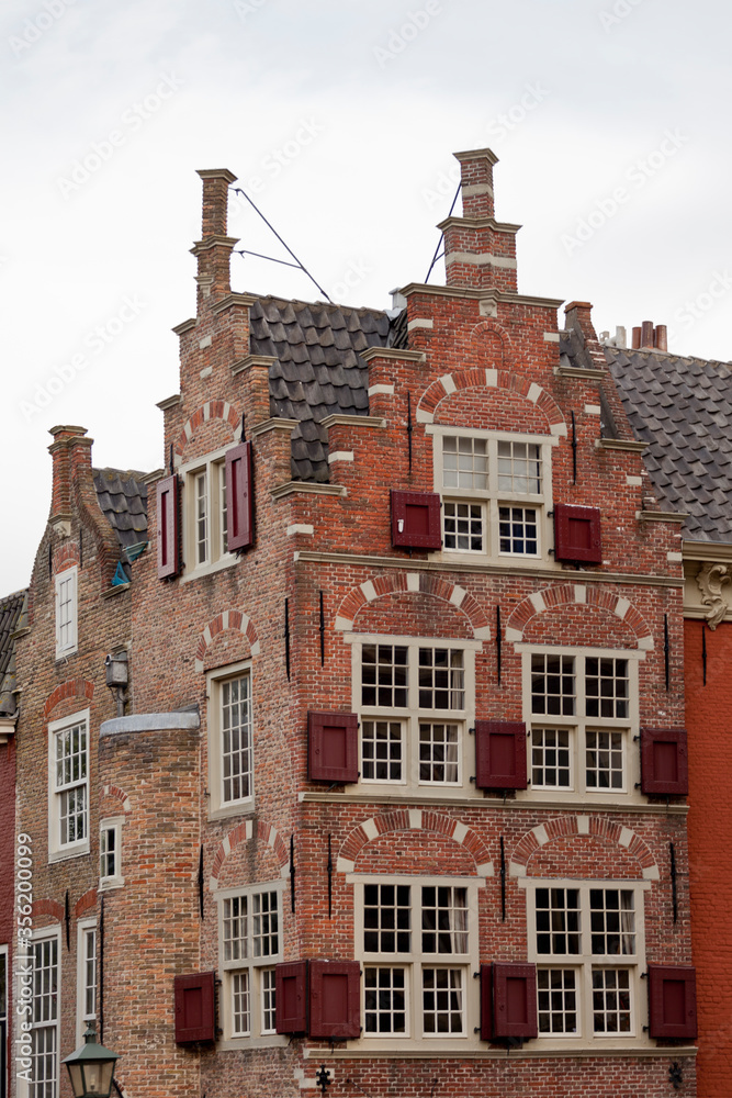 Dutch traditional rich medieval brick architecture with bright exterior ...