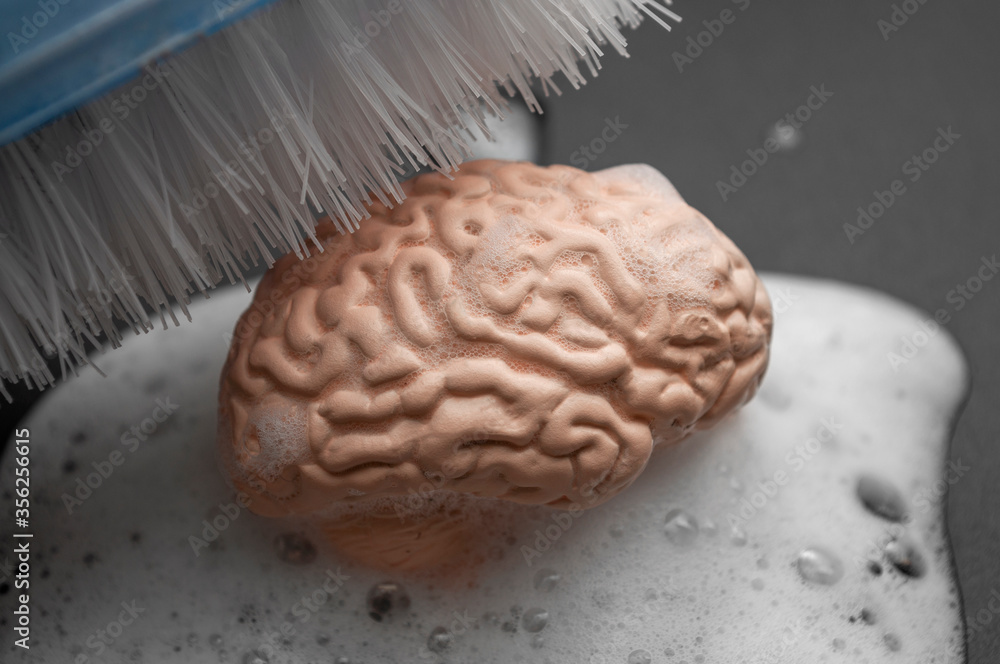 Brainwashing, lower critical thinking and mind control concept with ...