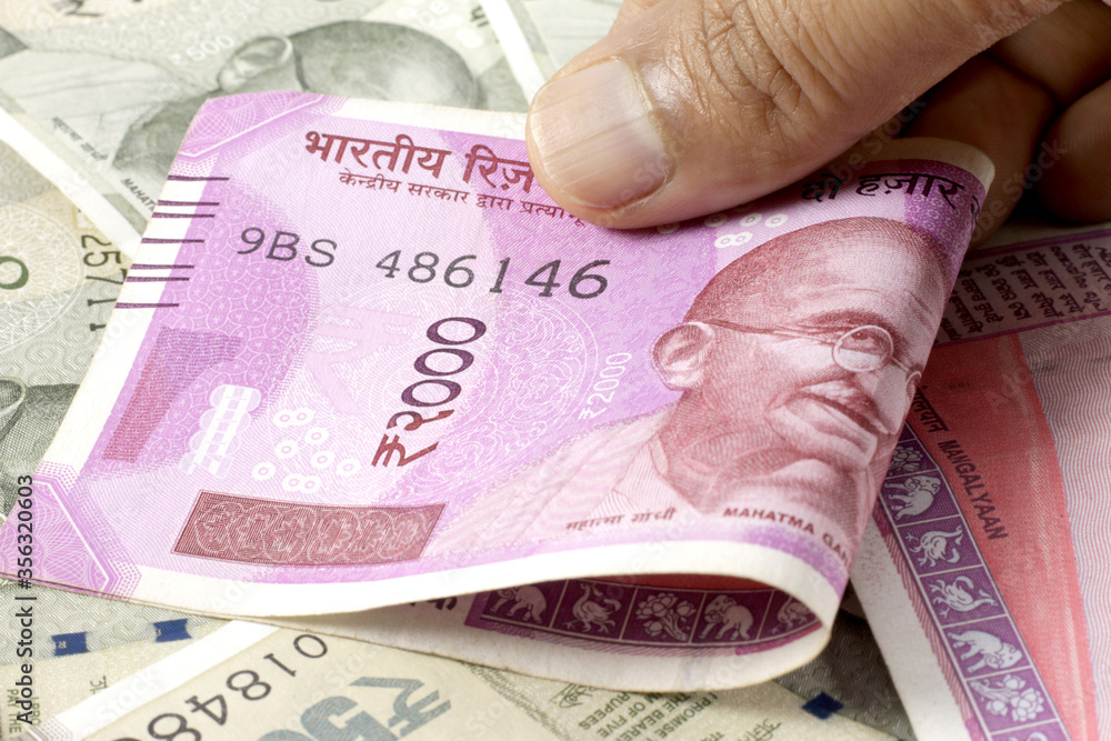 Indian Currency Notes In Hand A Hand Giving Money Indian Currency Of indian-currency-notes-in-hand-a-hand-giving-money-indian-currency-of