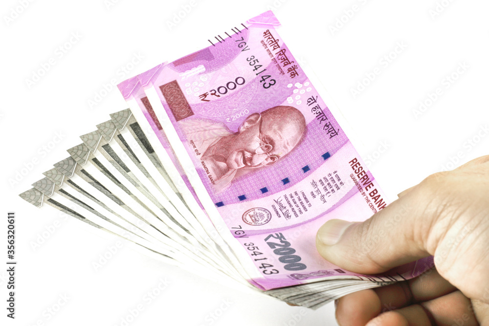Indian currency notes in hand. A hand giving money. Indian currency of ...