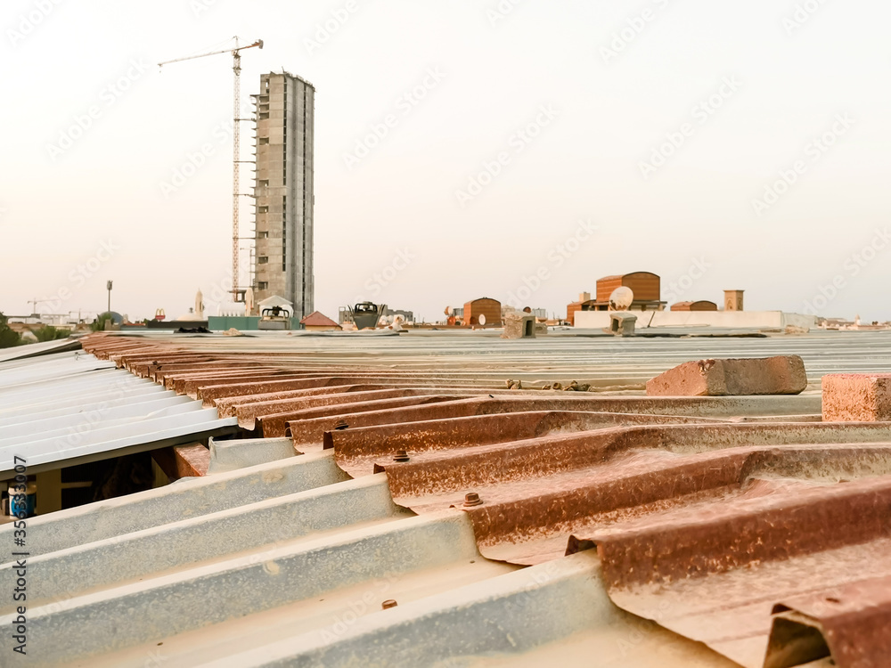 old and rusty slums roof top and city buildings in the background Stock ...