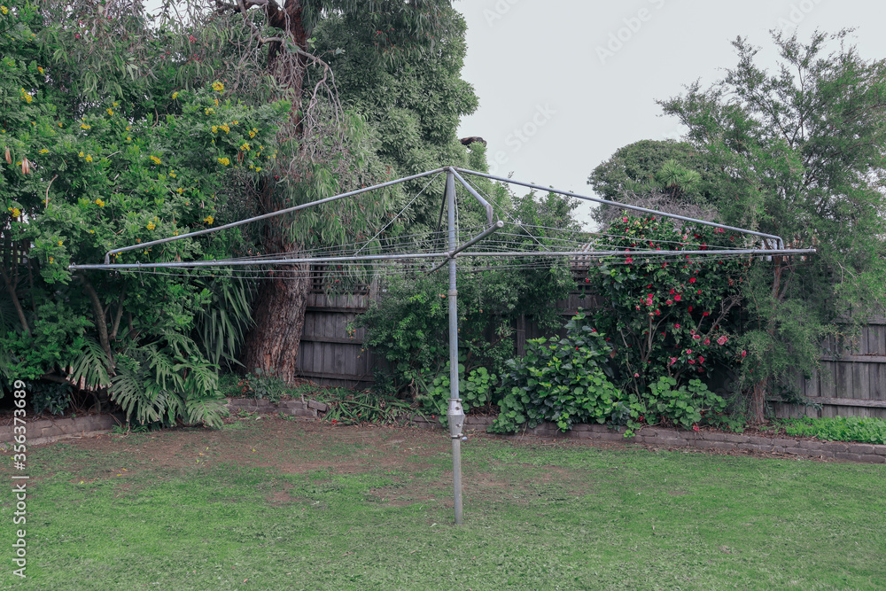 vintage rotary clothes line in australian backyard Stock Photo | Adobe ...