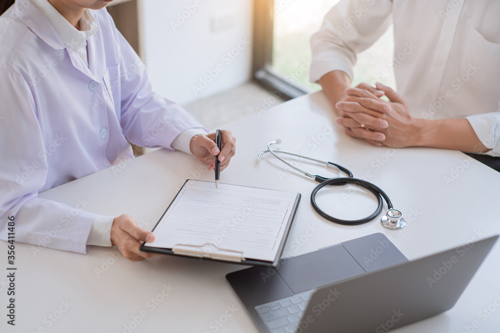 doctor giving consulting and diagnostic to patient and explaining ...